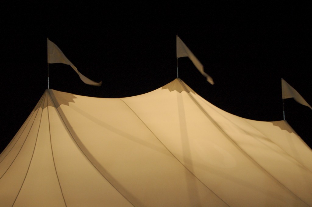 Tidewater Sailcloth Tent Flags at Night - Tent and Party Rentals Company
